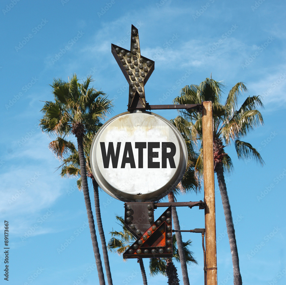 aged and worn vintage photo of water sign with palm trees Stock-Foto ...