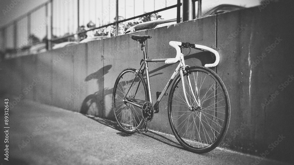 City fixie bike near the wall Photos | Adobe Stock