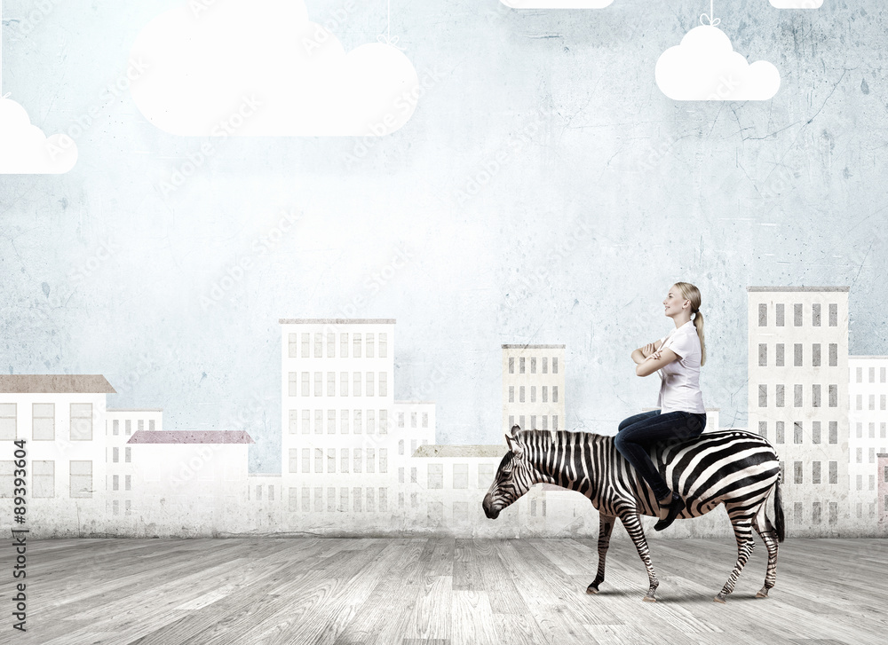 Woman ride zebra Stock Photo | Adobe Stock
