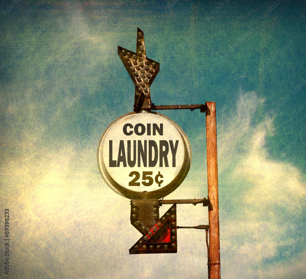 aged and worn vintage photo of coin laundry sign Stock Photo | Adobe Stock