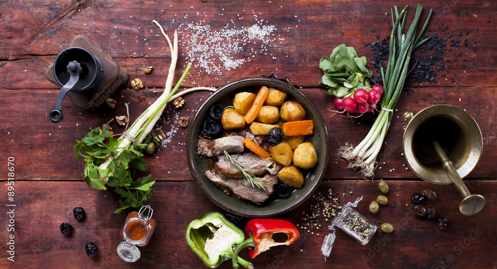 Food in ceramic plate on a wooden board, bird's-eye view Stock Photo ...