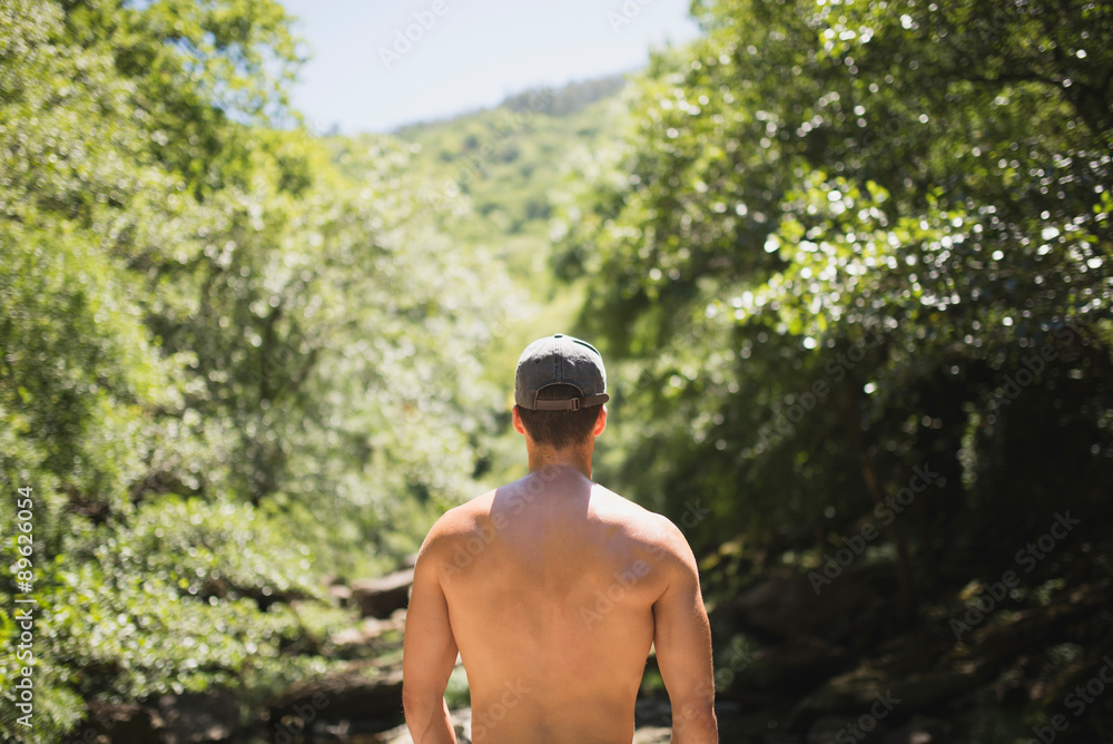 Back of a shirtless man with peaked cap Stock Photo | Adobe Stock