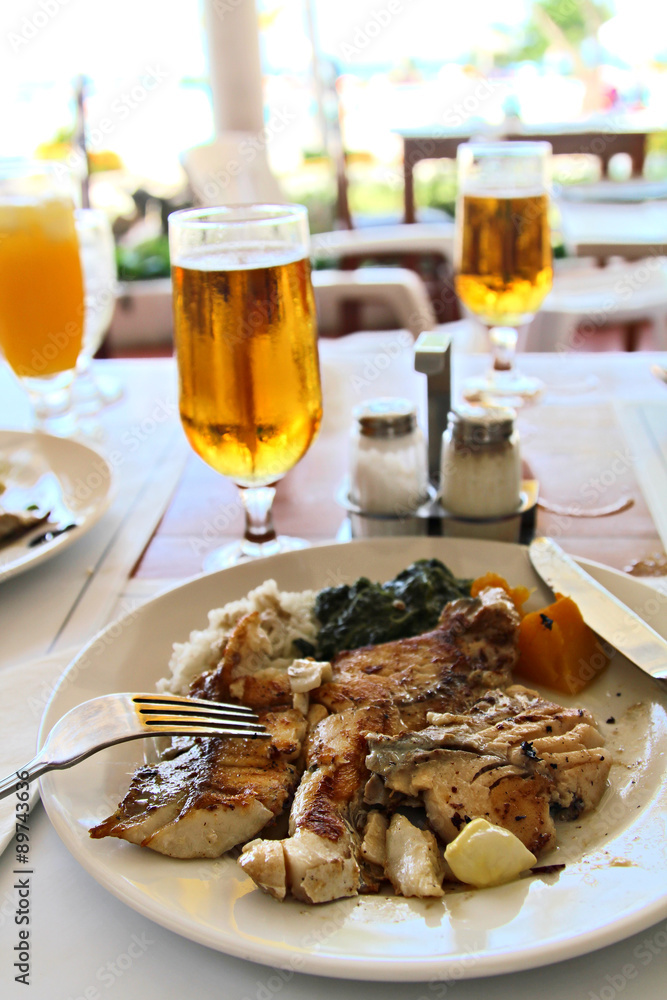 Fried fish with beer in the beach restaurnat, shallow focus Stock Photo ...