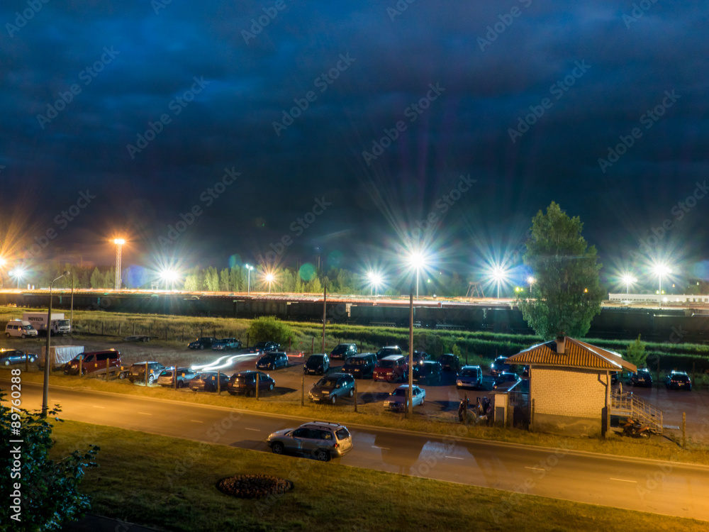 car parking at night with street lights and dark clouds Stock Photo ...