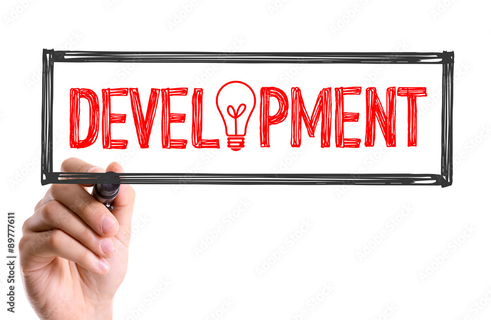 Hand with marker writing the word Development Stock Photo | Adobe Stock