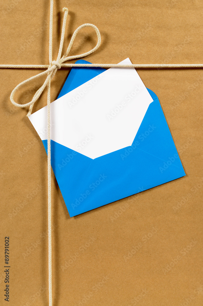 Brown paper parcel or wrapped package background with greeting card ...