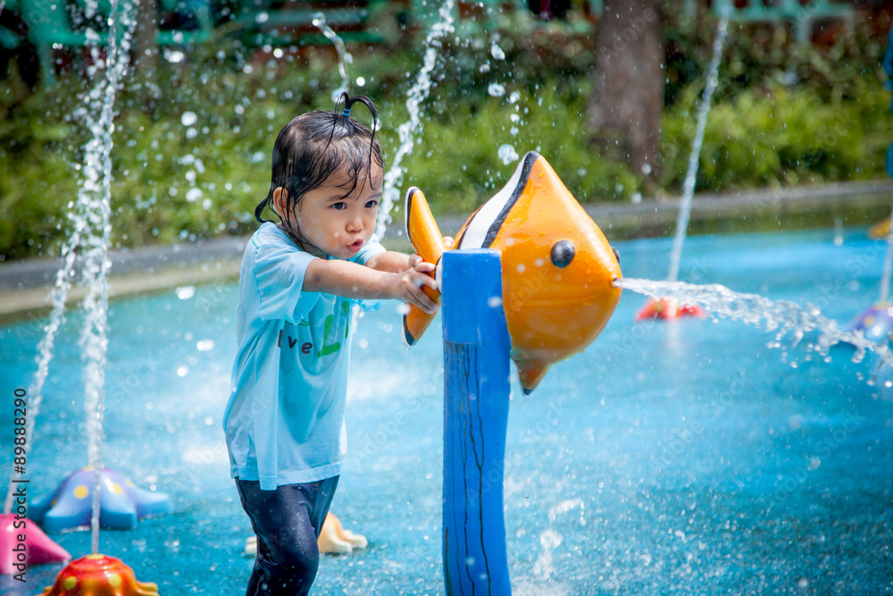Child little girl having fun to play with water in park fountain Stock ...