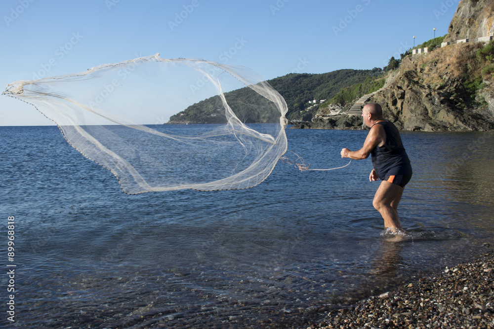 Fisherman with net foto de Stock | Adobe Stock