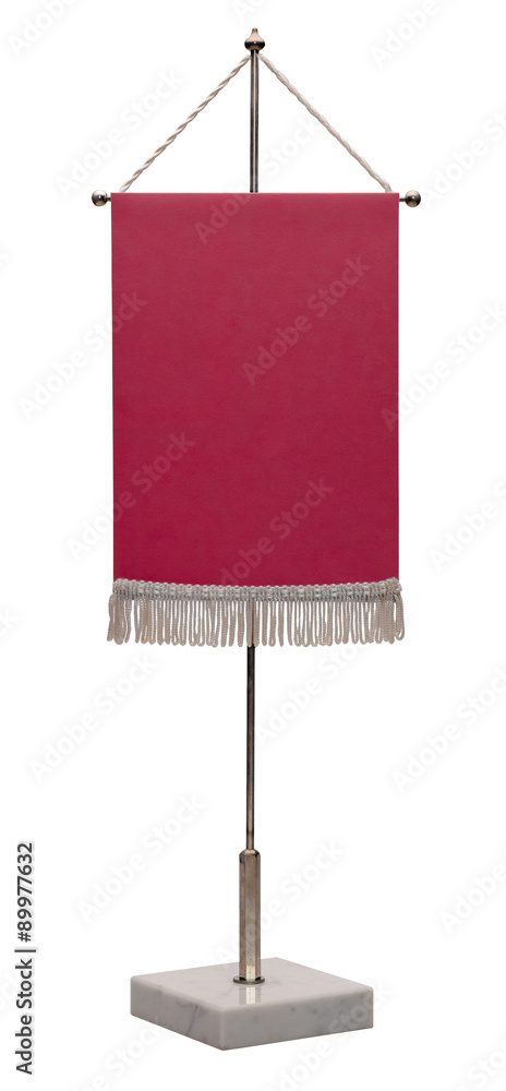 Red pennant on steel spire on a marble pedestal isolated on white ...