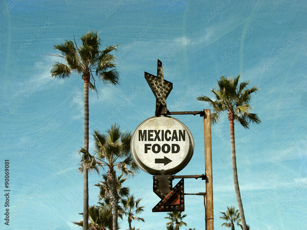 aged and worn vintage photo of mexican food sign with palm trees Stock ...