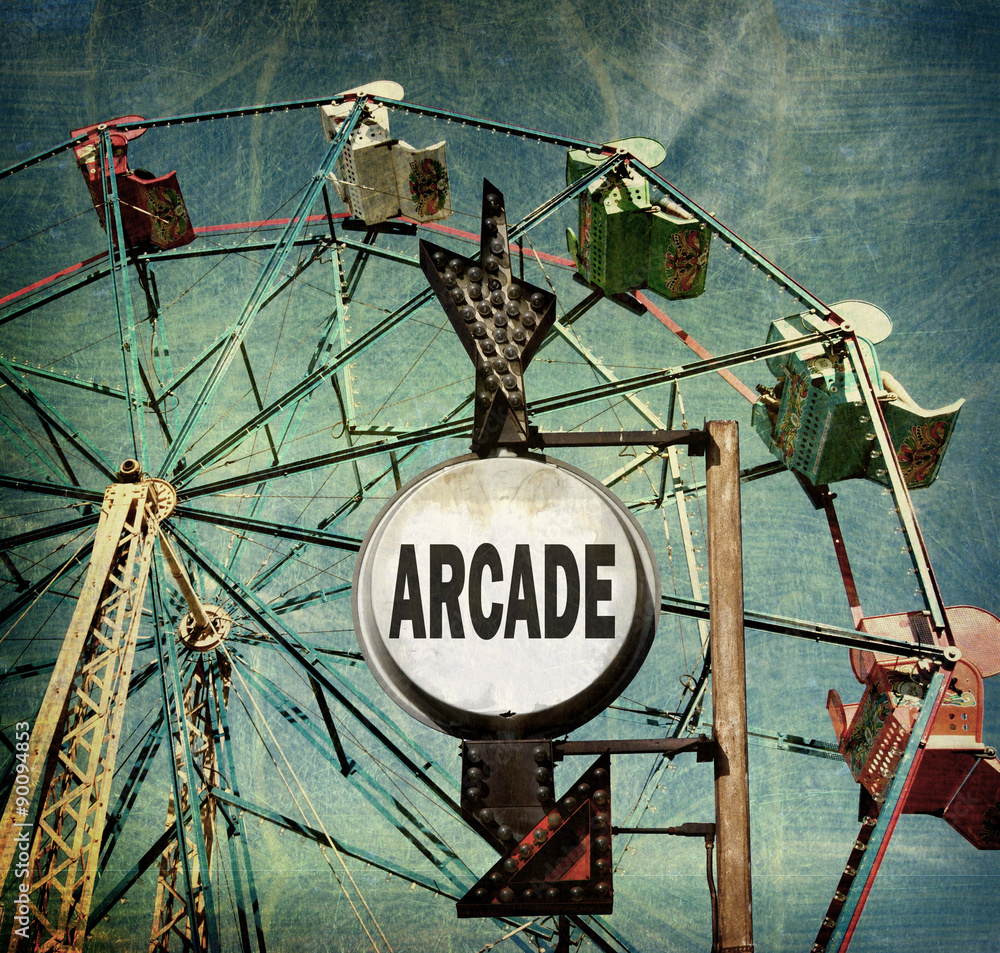 aged and worn vintage photo of ferris wheel with arcade sign Stock ...