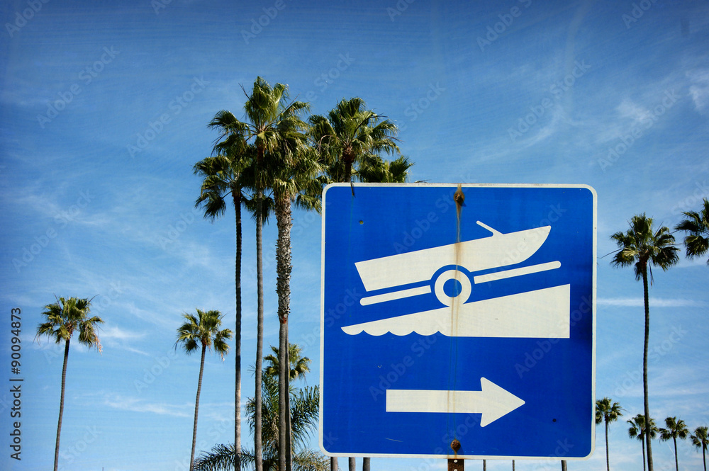 aged and worn vintage photo of boat launch sign with palm trees Stock ...