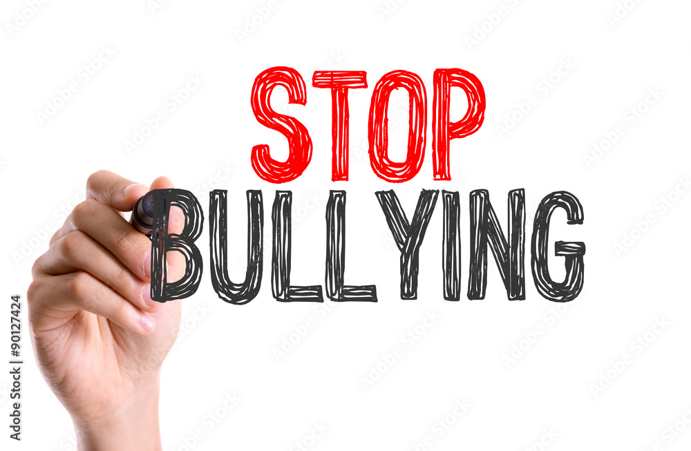 Hand with marker writing the word Stop Bullying Photos | Adobe Stock