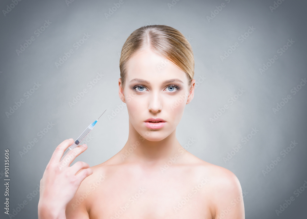 A young woman having a botox treatment. Stock Photo | Adobe Stock