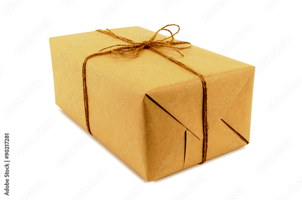 One single small brown paper package parcel tied with string isolated ...