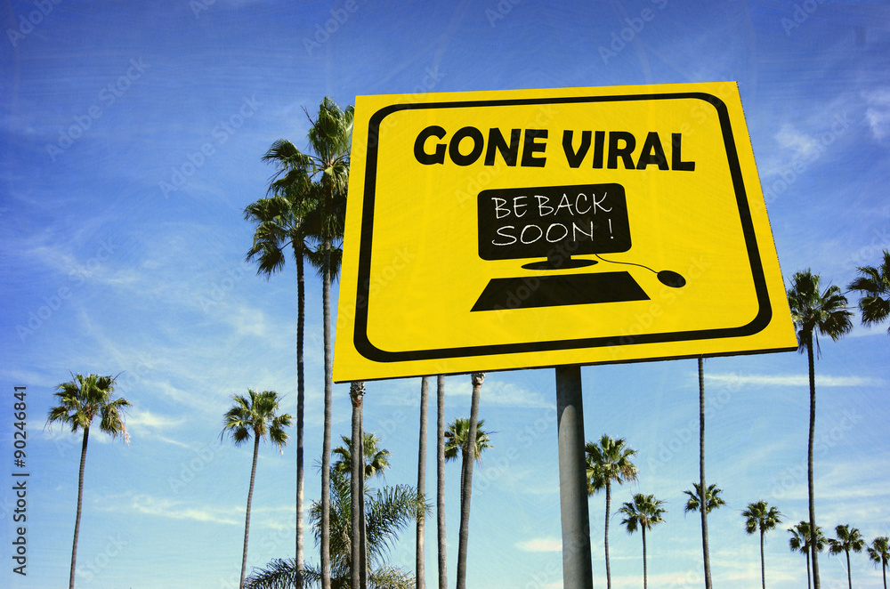 aged and worn vintage photo of gone viral sign at beach with palm trees ...