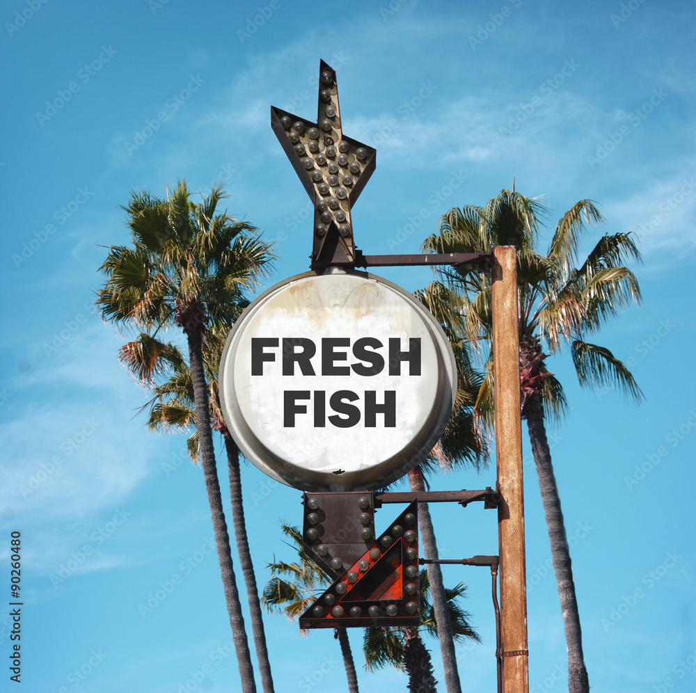 aged and worn vintage photo of fresh fish sign and palm trees Stock ...
