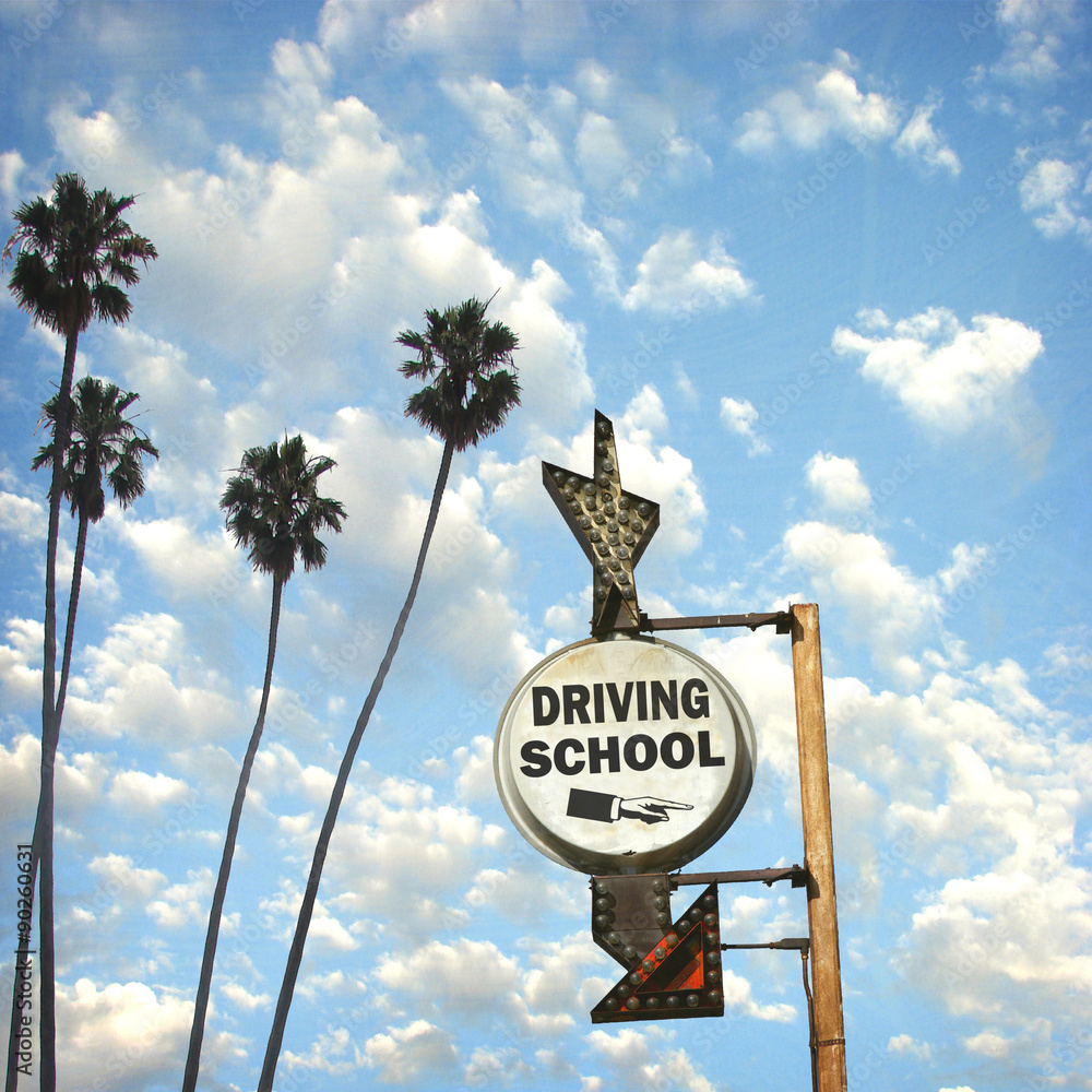 aged and worn vintage photo of driving school sign palm trees Stock ...