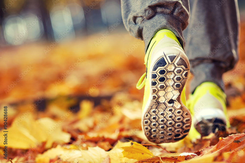 Runner woman feet running on autumn road closeup on shoe. Female ...