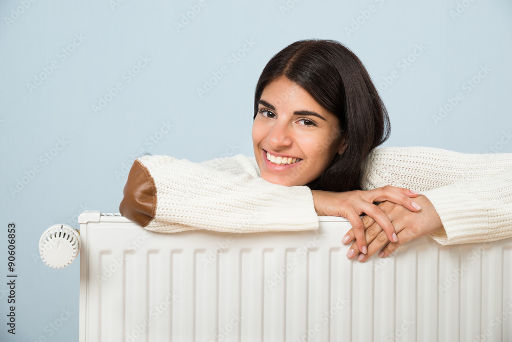 Woman Leaning On Radiator Stock-Foto | Adobe Stock