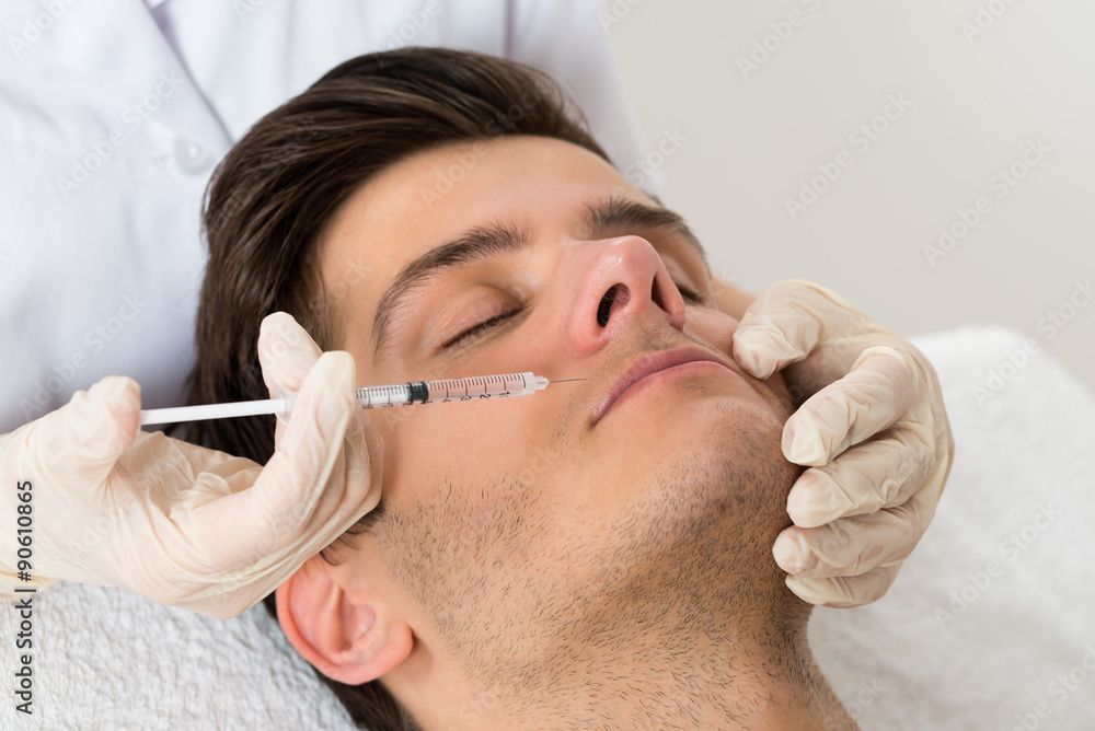 Fotografia do Stock: Man Receiving Cosmetic Injection with Syringe ...