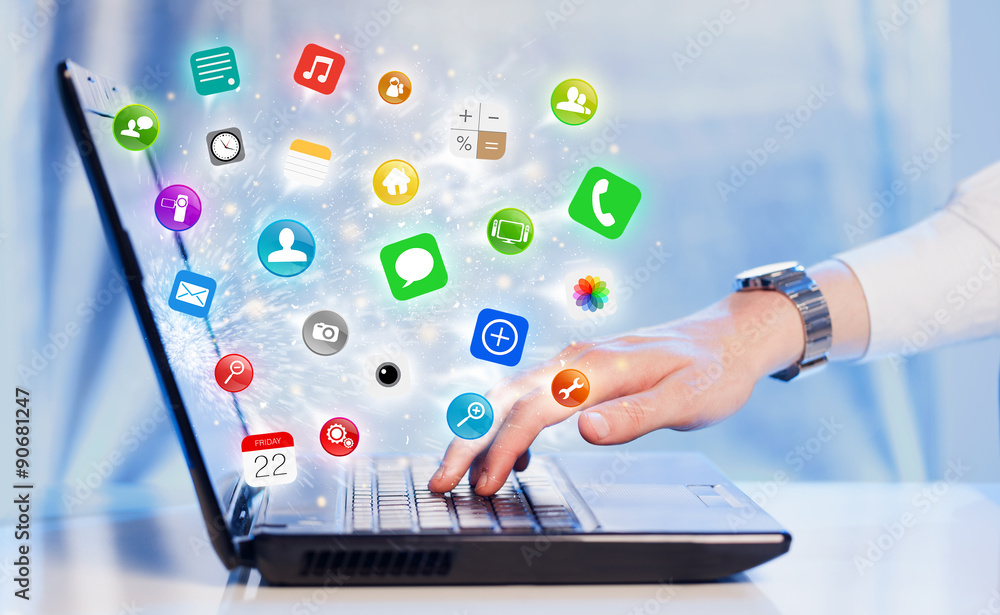 Hand pressing modern laptop with mobile app icons and symbols Stock ...