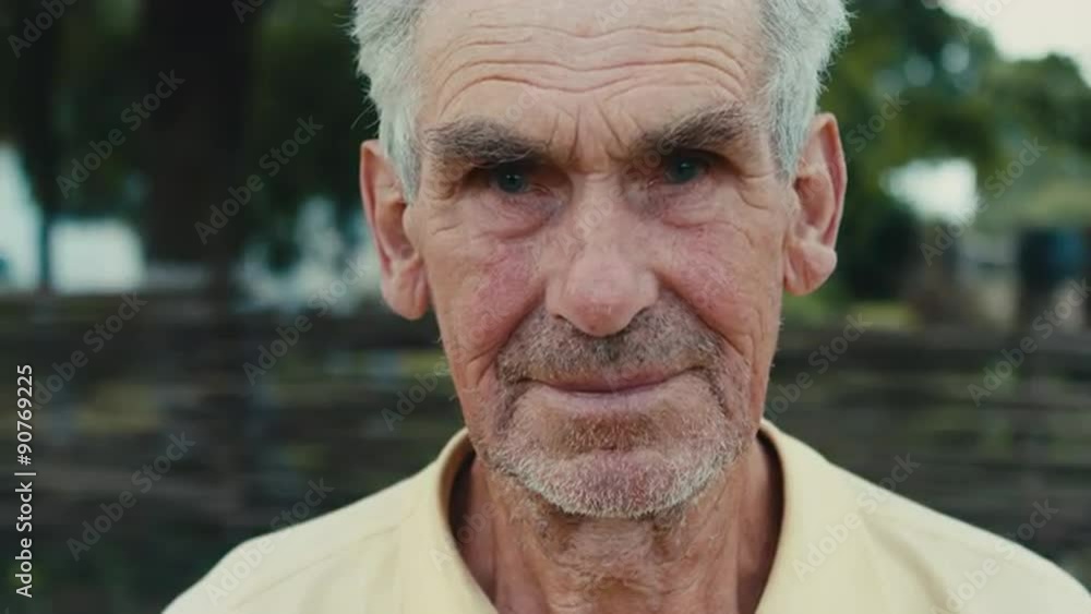 Portrait of old wrinkled and gray-haired old man with close Stock Video ...