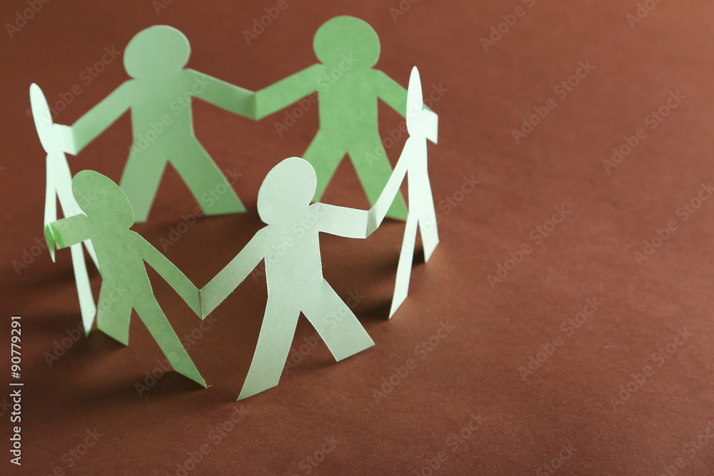 Paper people on the brown paper background Stock-Foto | Adobe Stock