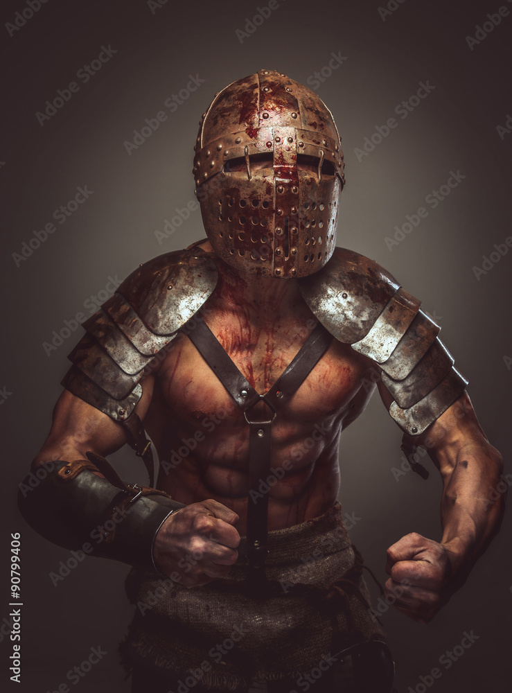 Angry bloody gladiator in helmet and ancient armor. Stock Photo | Adobe ...