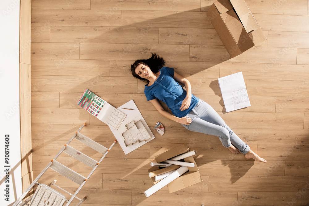 Top view, a modern woman lying on the floor of her new home Stock Photo ...