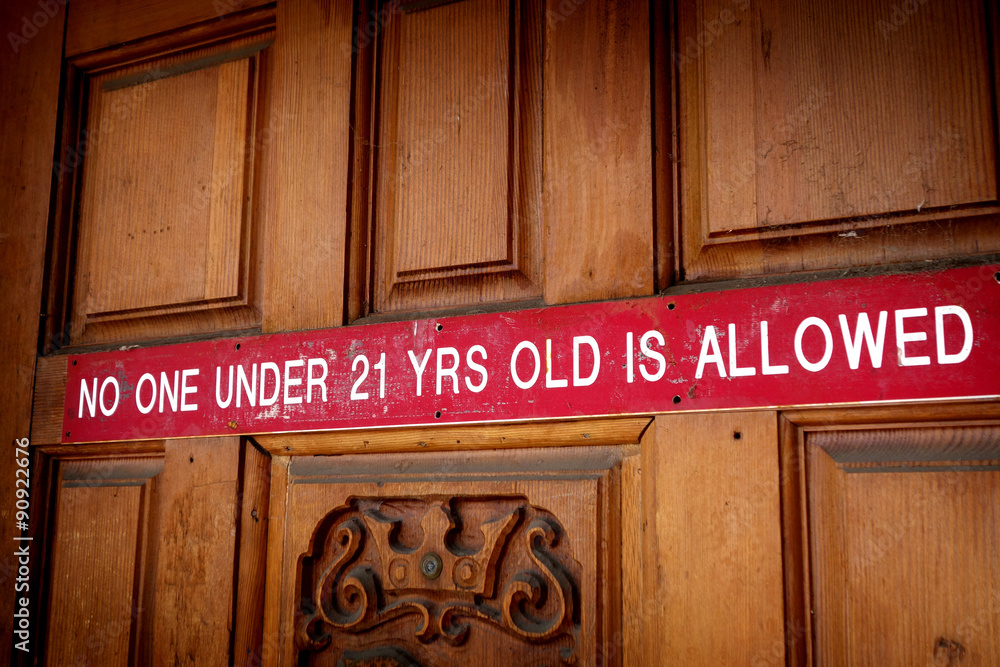 no one under 21 allowed sign on bar door Stock Photo | Adobe Stock
