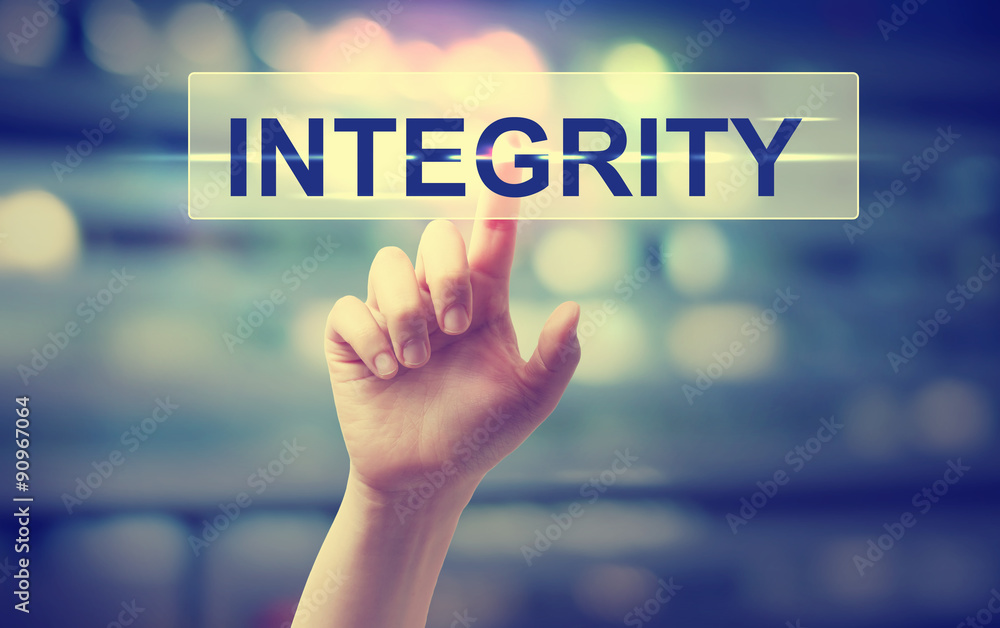 Hand pressing an integrity button on blury city lights background Stock ...