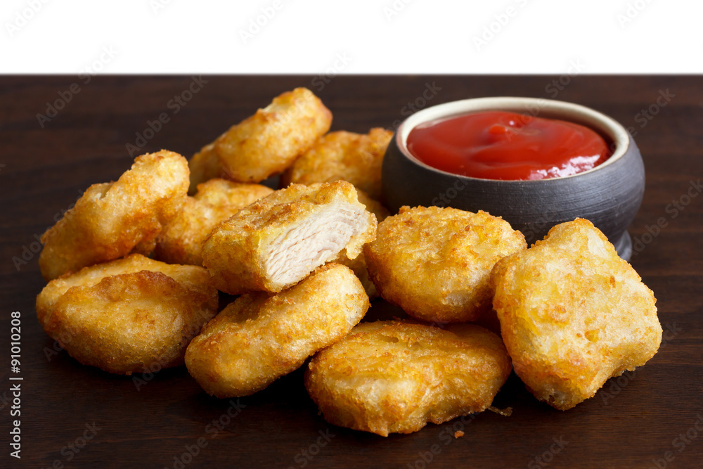 Pile of golden deep-fried battered chicken nuggets with empty ru Stock ...