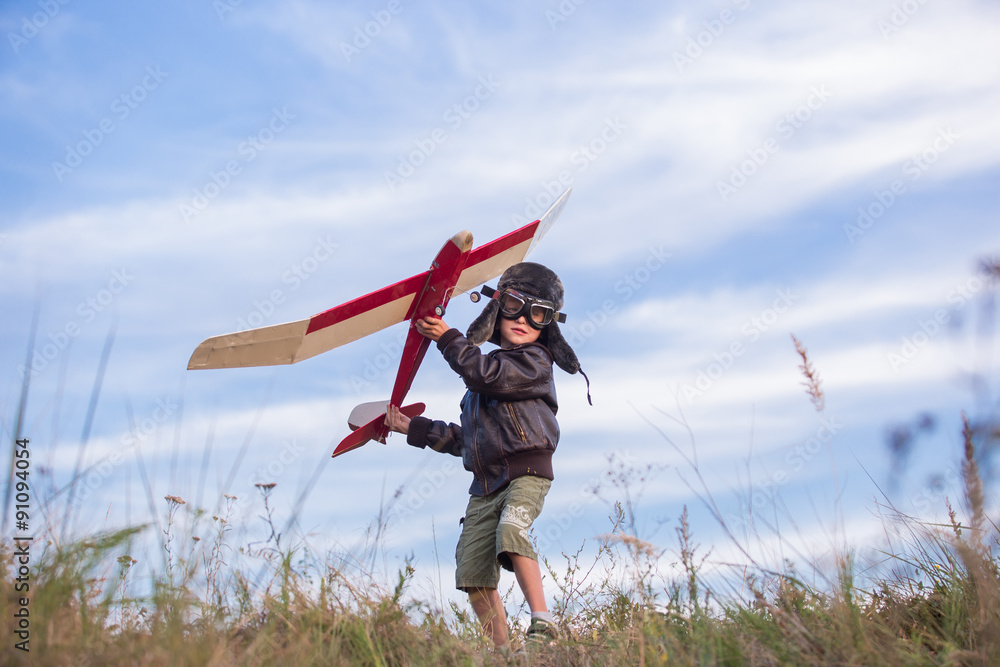 boy with a model airplane field, Young boy-pilot Stock Photo | Adobe Stock
