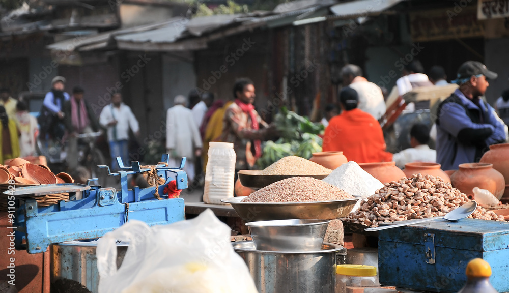 Indian colored spices at local market. Small shops like this are the ...