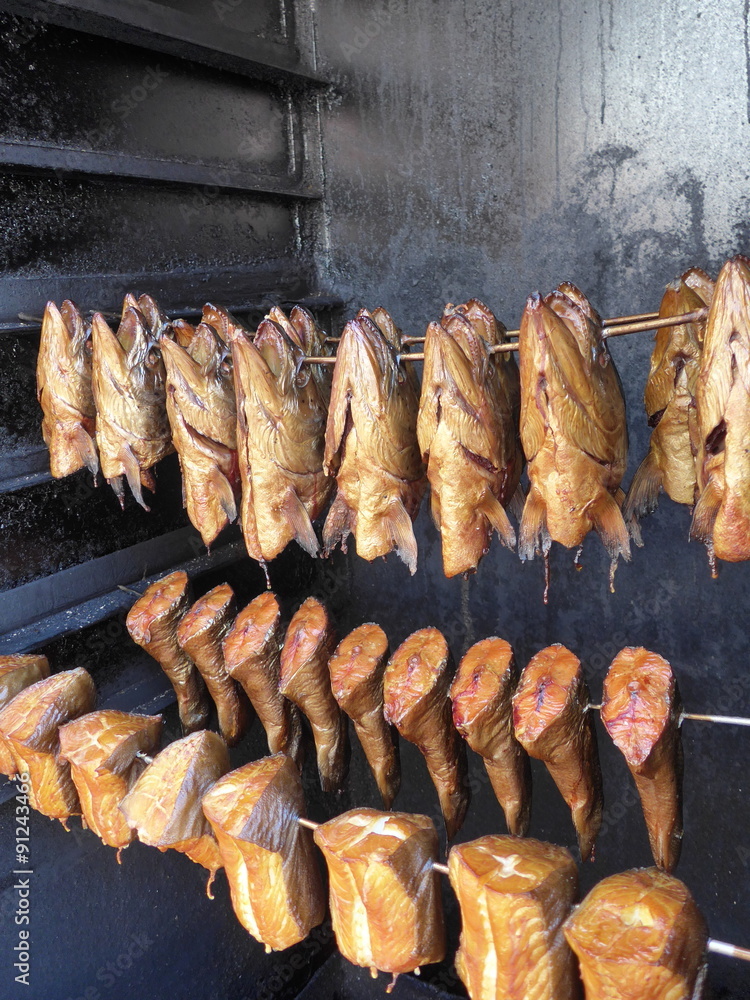 Smoked fish in the smokehouse - Bild - Stock-Foto | Adobe Stock