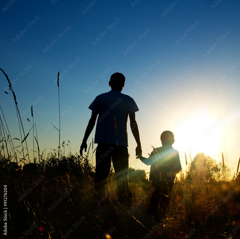 Silhouette father and son at sunset Stock Photo | Adobe Stock