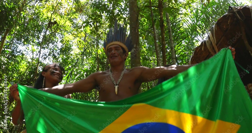 Native Brazilians showing the Brazilian Flag at an indigenous tribe in ...