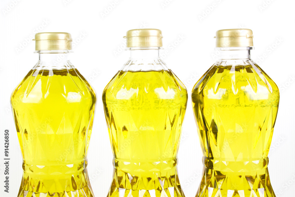 three bottles oil of refined palm olein from pericarp Stock Photo ...