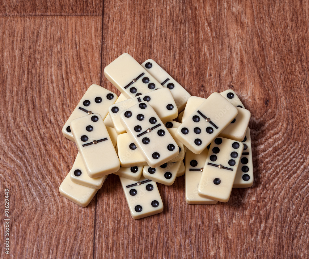 domino pieces on the brown wooden table background Stock Photo | Adobe ...