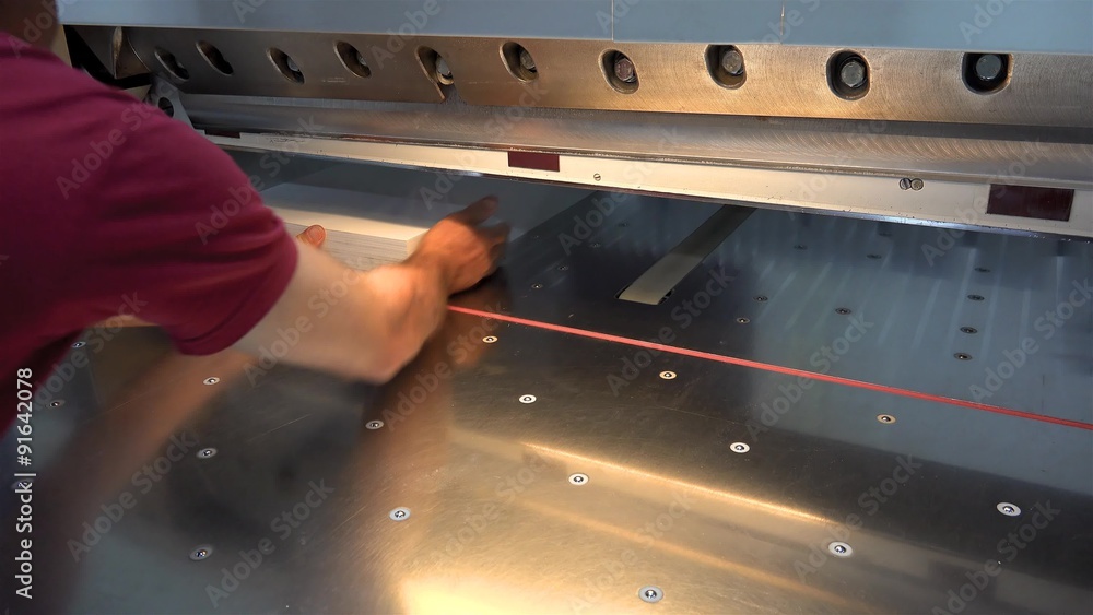Modern paper guillotine in commercial printing industry (industrial ...