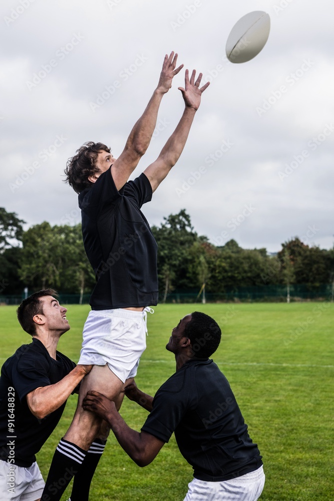 Rugby players jumping for line out Stock Photo | Adobe Stock