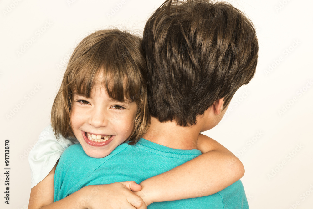 Children hugging and smiling Stock Photo | Adobe Stock