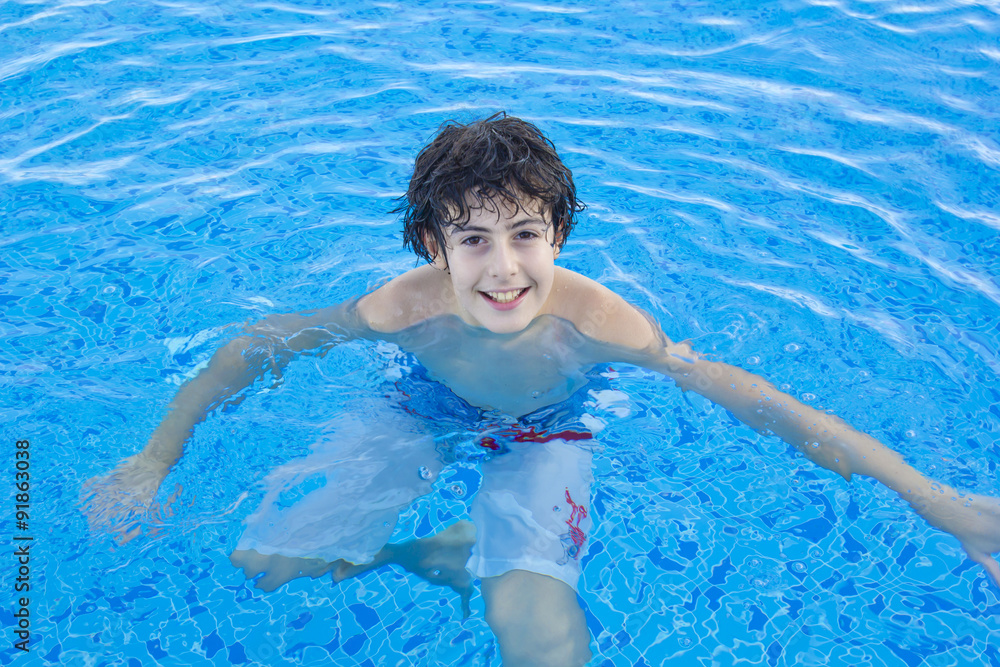 Happy boy in the swimming pool Stock Photo | Adobe Stock
