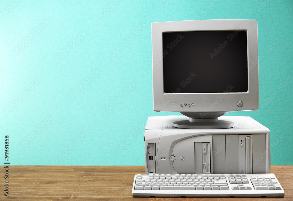 Obsolete computer set on light blue background Stock Photo | Adobe Stock
