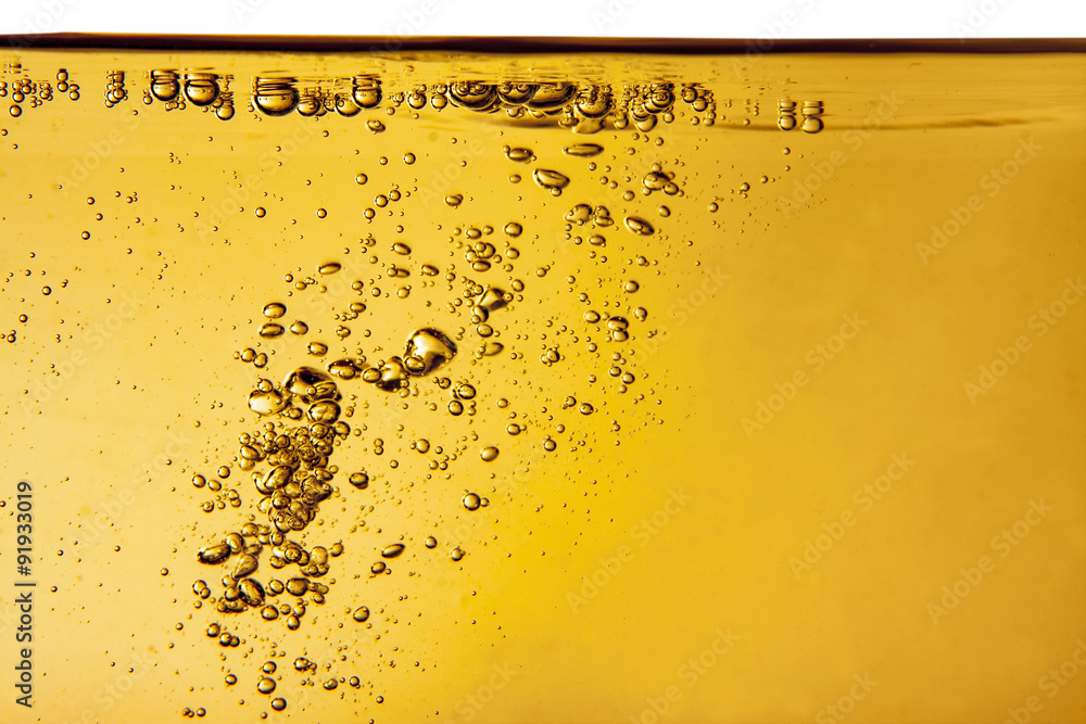 Yellow liquid with bubbles Stock Photo | Adobe Stock
