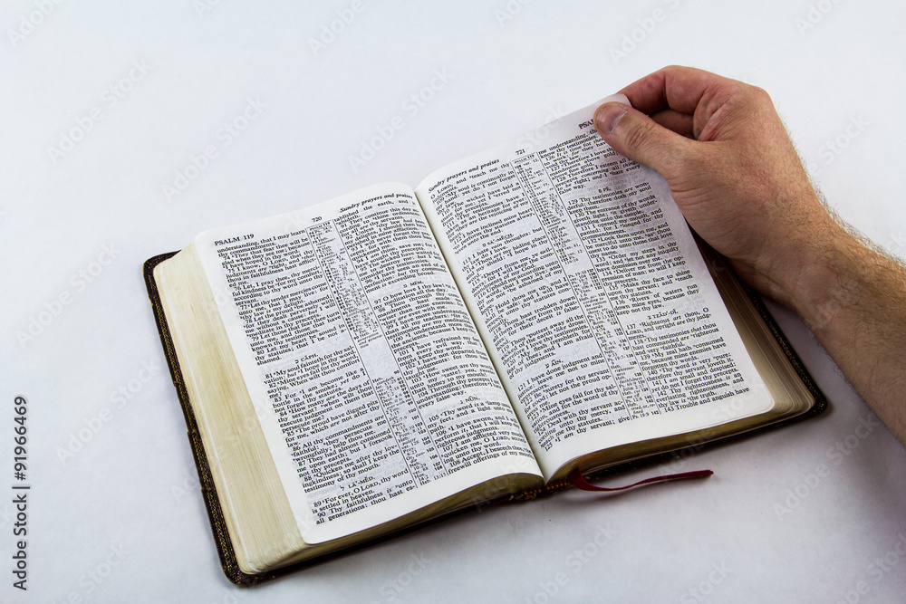 Reading a Bible on White Background Stock Photo | Adobe Stock