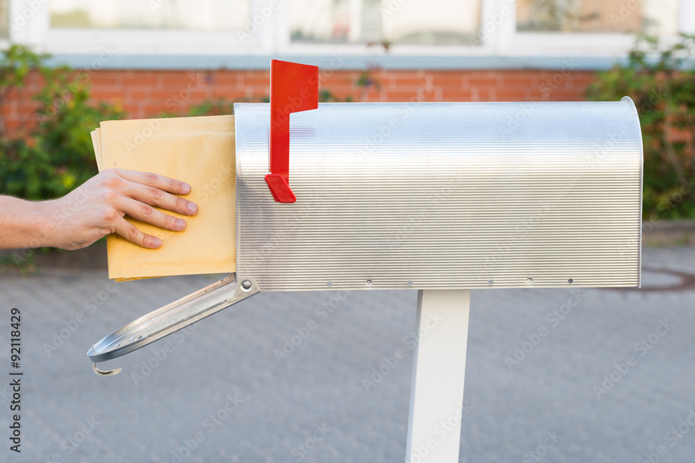 Person Putting Letters In Mailbox Stock Photo | Adobe Stock