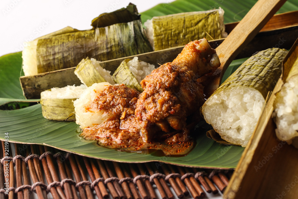 malay lemang served with rendang ayam Stock Photo | Adobe Stock