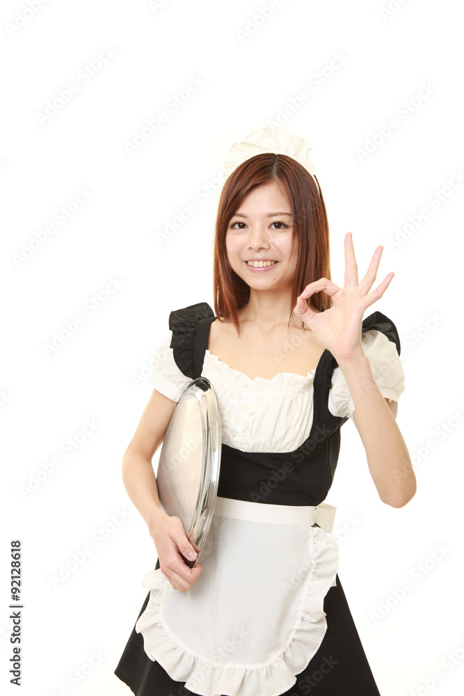young Japanese woman wearing french maid costume showing perfect sign ...